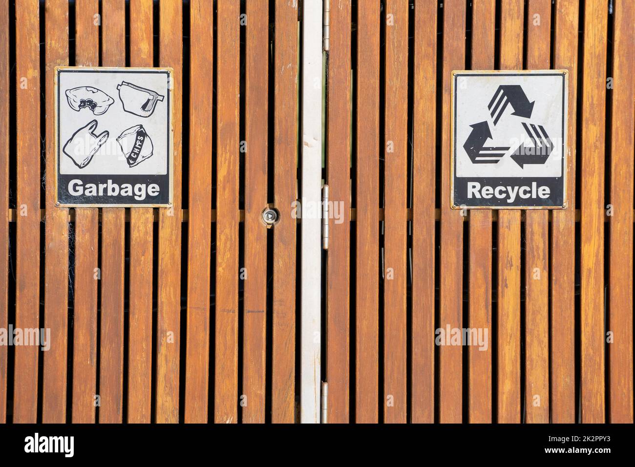 The garbage and recycle signs on wooden doors Stock Photo - Alamy