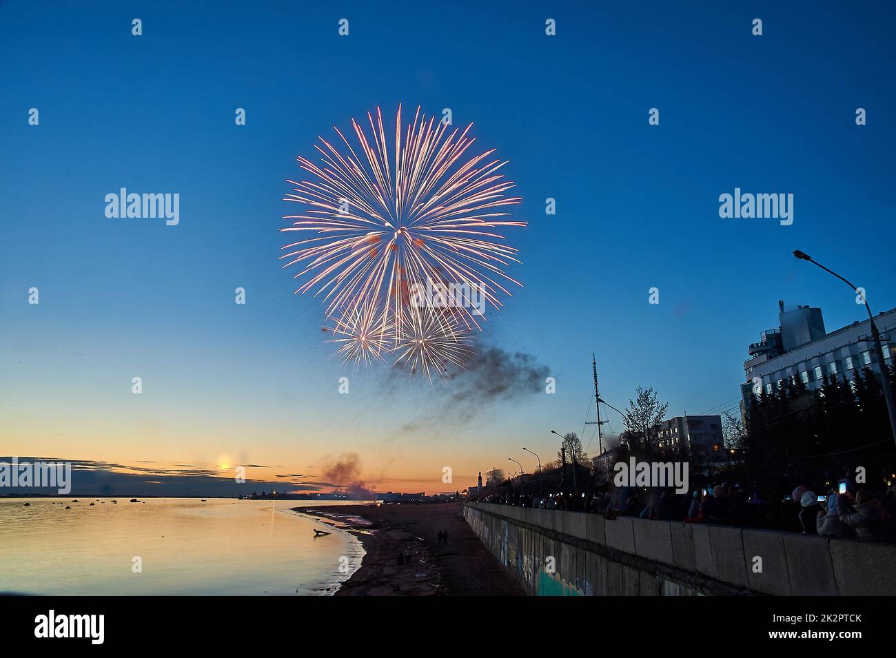 Colorful fireworks on the background of the sky on the river bank Stock ...