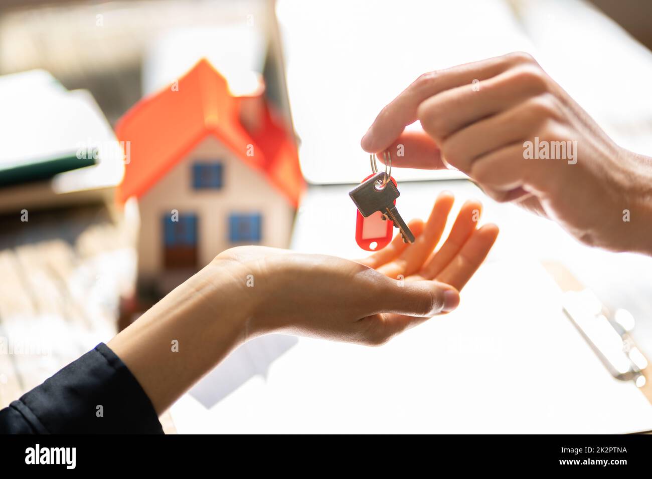 Agent giving woman client hi-res stock photography and images - Alamy