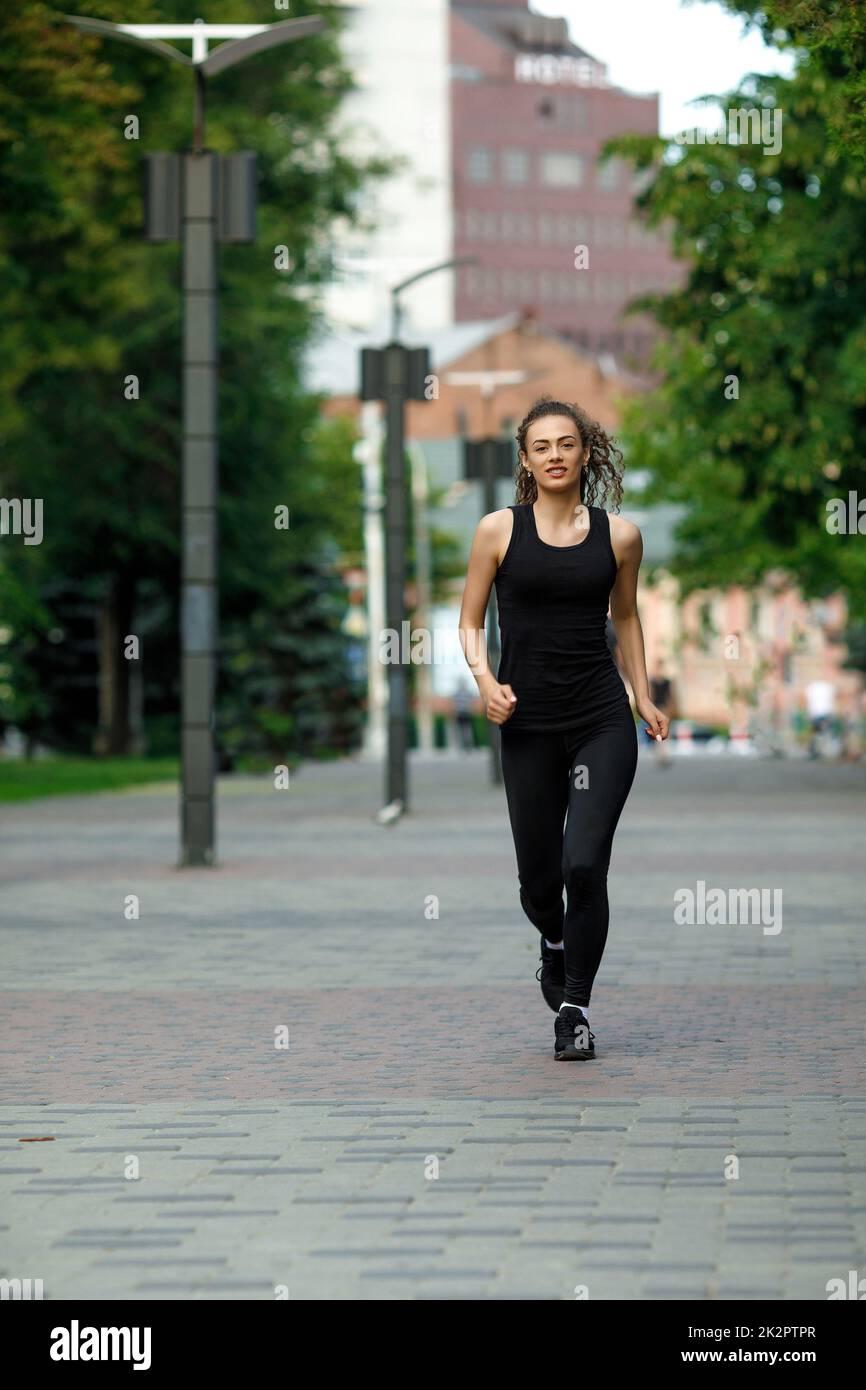 young attractive woman running Stock Photo - Alamy