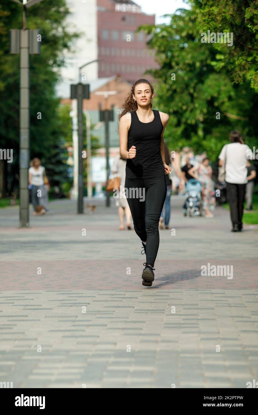 young attractive woman running Stock Photo - Alamy