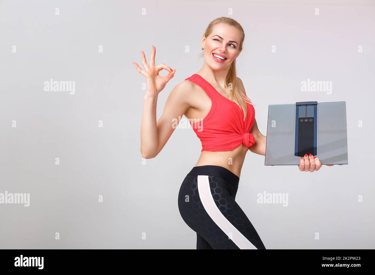 woman holding scales in hands Stock Photo - Alamy