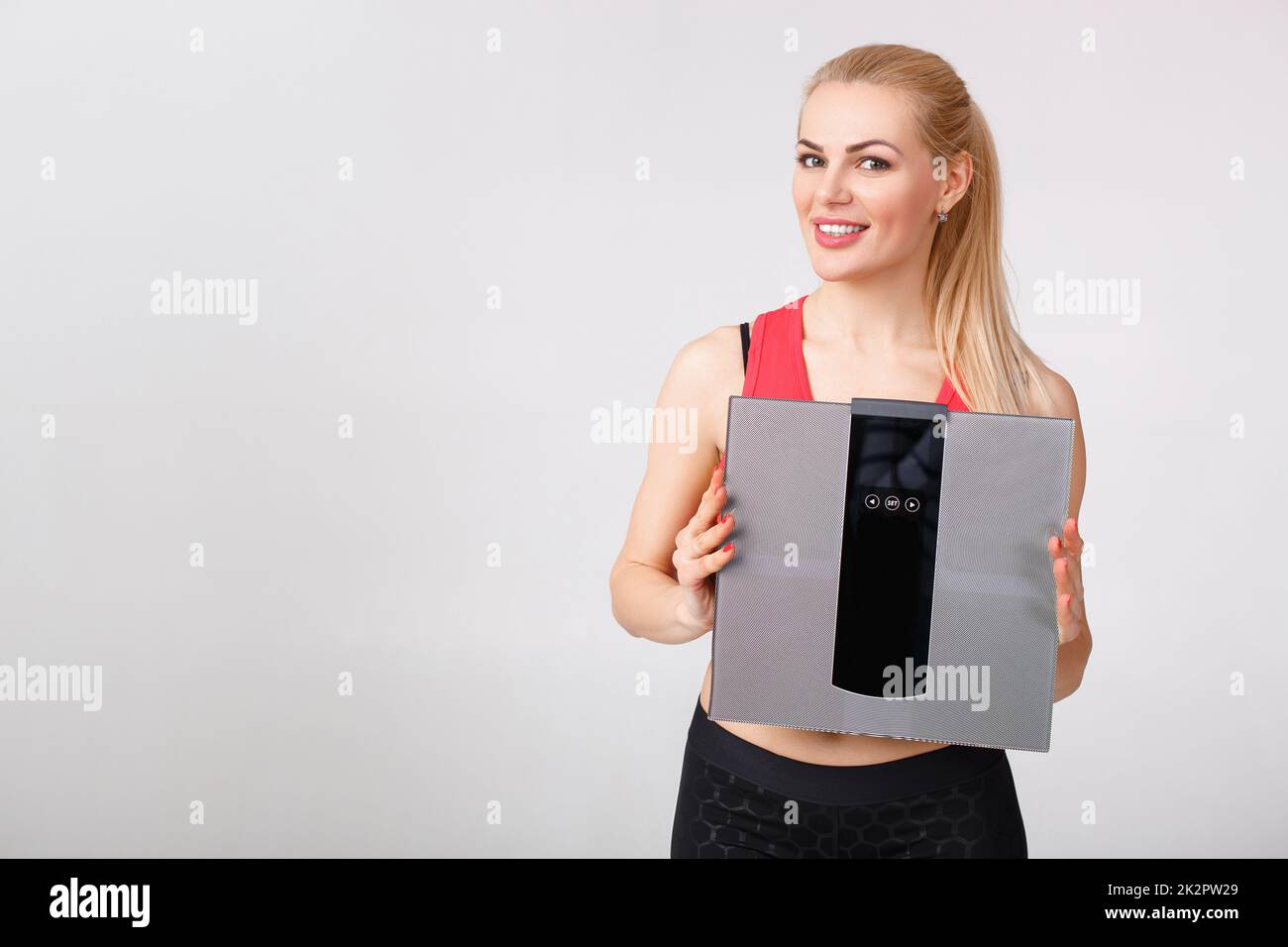 woman holding scales in hands Stock Photo - Alamy