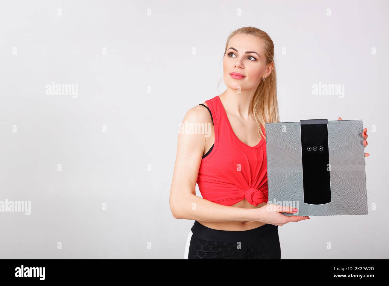 Big woman scales hi-res stock photography and images - Alamy