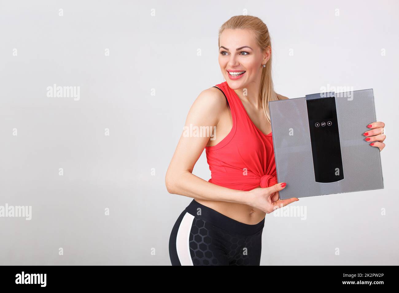 woman holding scales in hands Stock Photo - Alamy