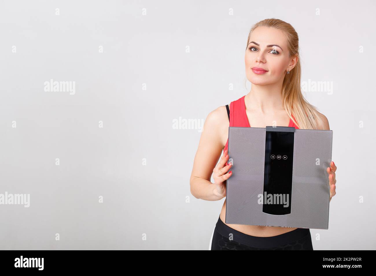 woman holding scales in hands Stock Photo - Alamy