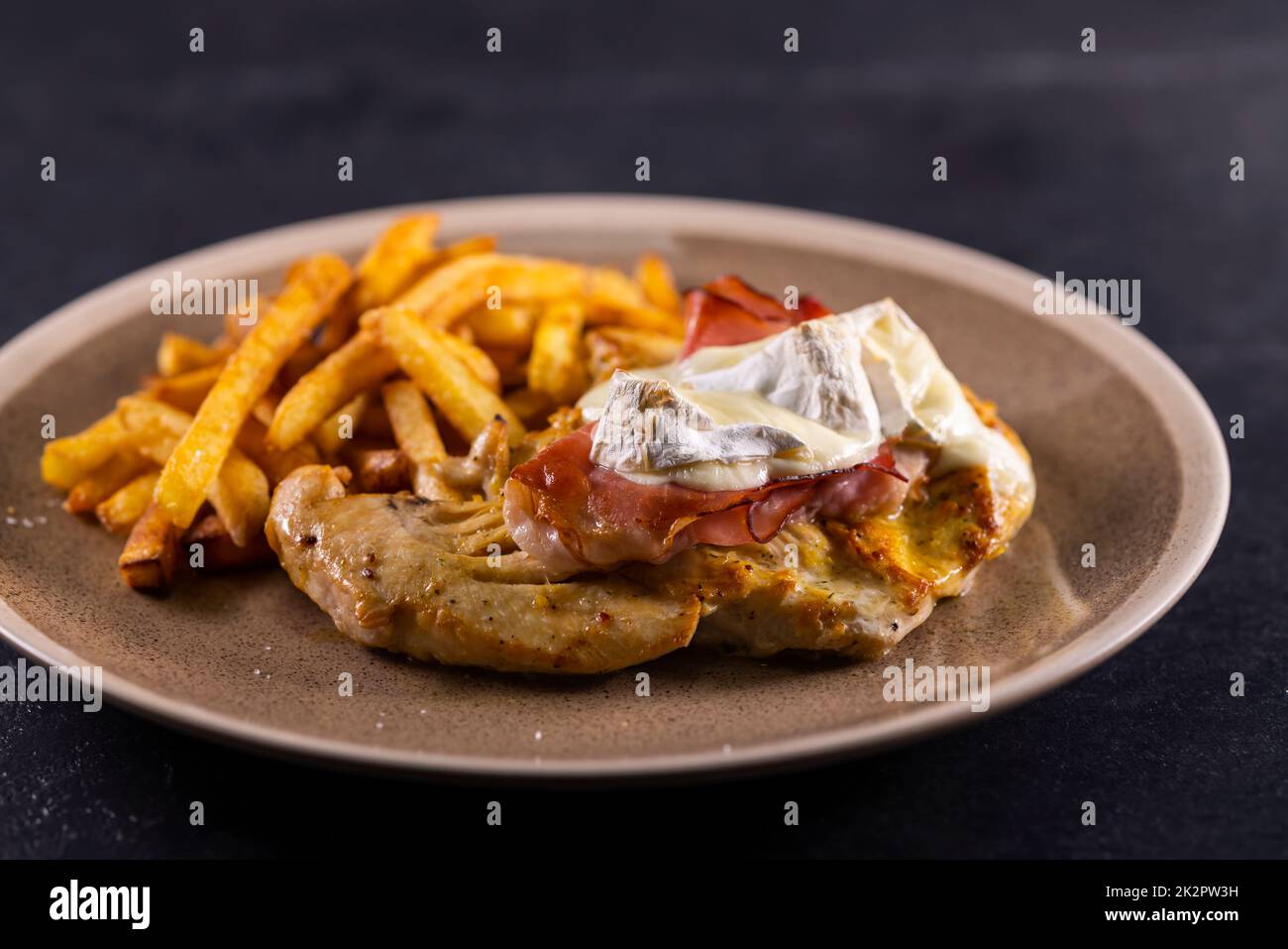 typical czech cuisine chicken slice baked with ham and camembert with ...