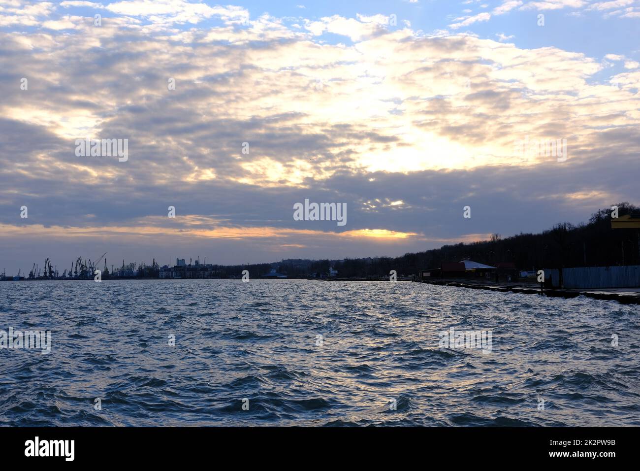 Sunset in azov sea with view on Port Mariupol, Ukraine Stock Photo - Alamy