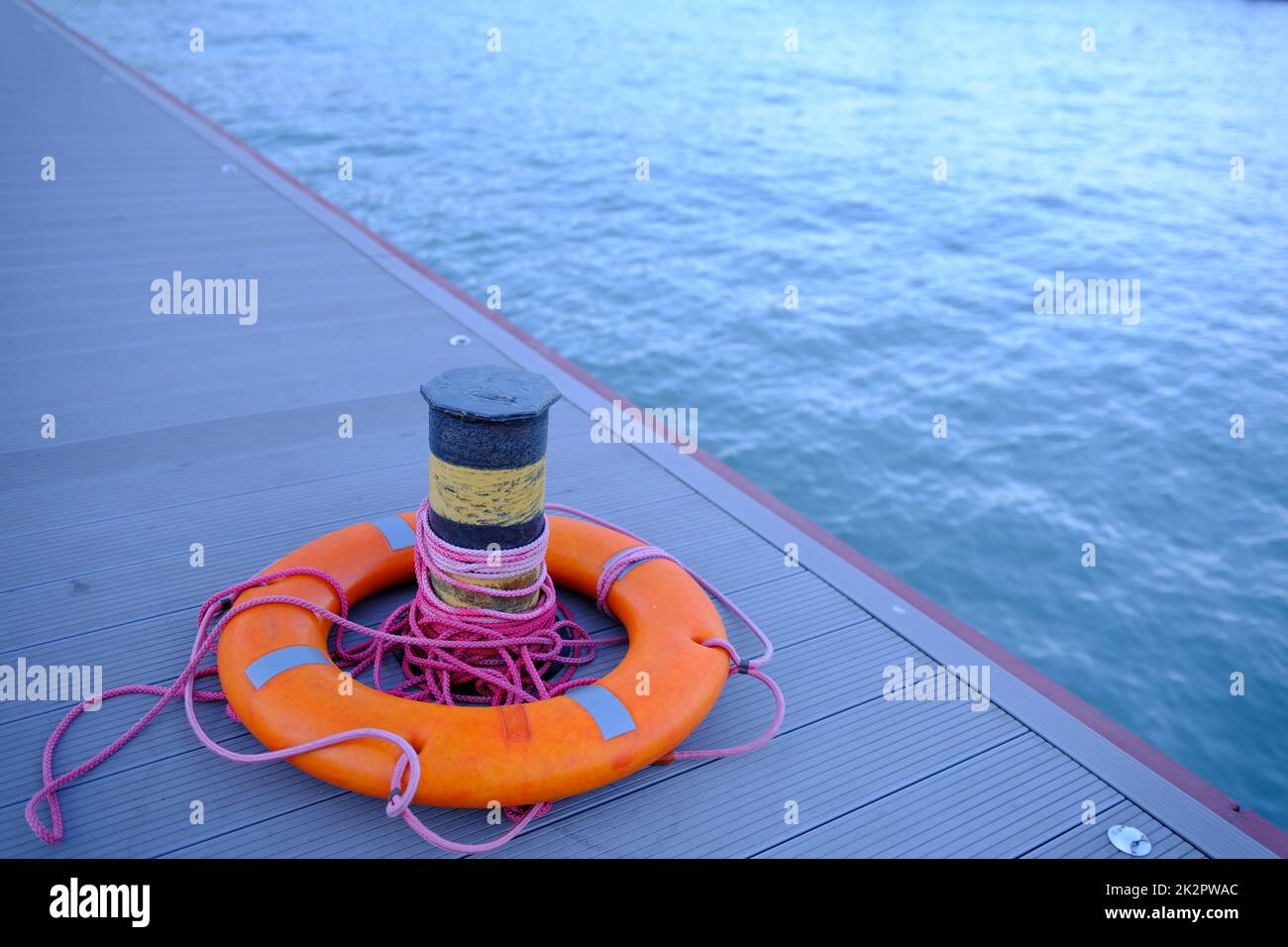 Lifebuoy ring on berth near the bollard with sea view outdoors Stock ...