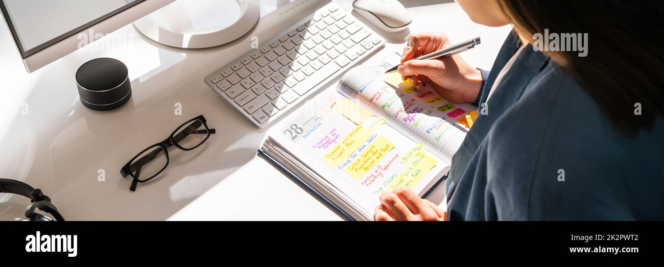 Looking At Calendar Schedule And Agenda Stock Photo - Alamy