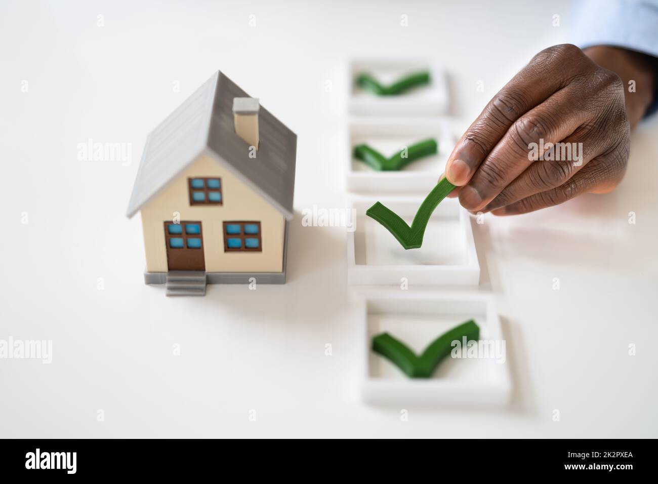 Person's Hand Solving Check Mark Puzzle Stock Photo - Alamy