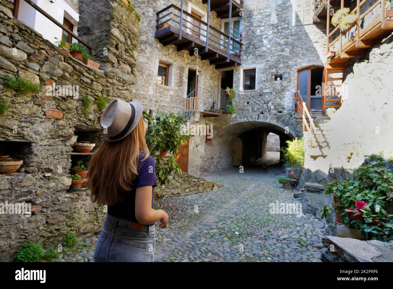 Tourism in Lombardy, Italy. Back view of beautiful girl visiting ...