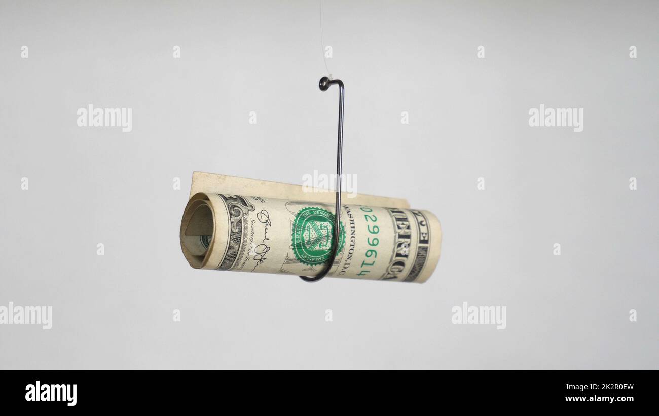 Dollar On A Fishing Hook Isolated On White Background Stock Photo - Alamy