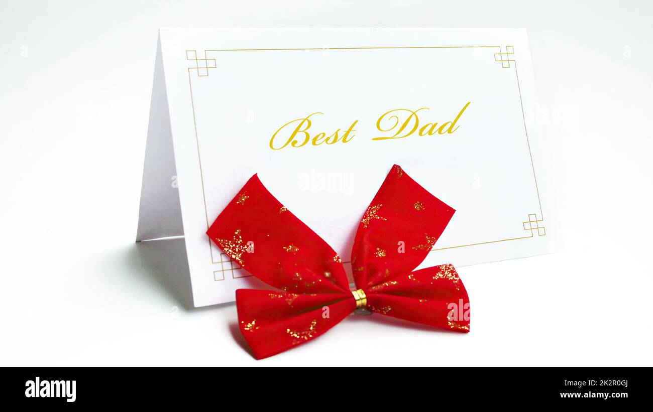 Best dad text on greeting card with bow Stock Photo - Alamy