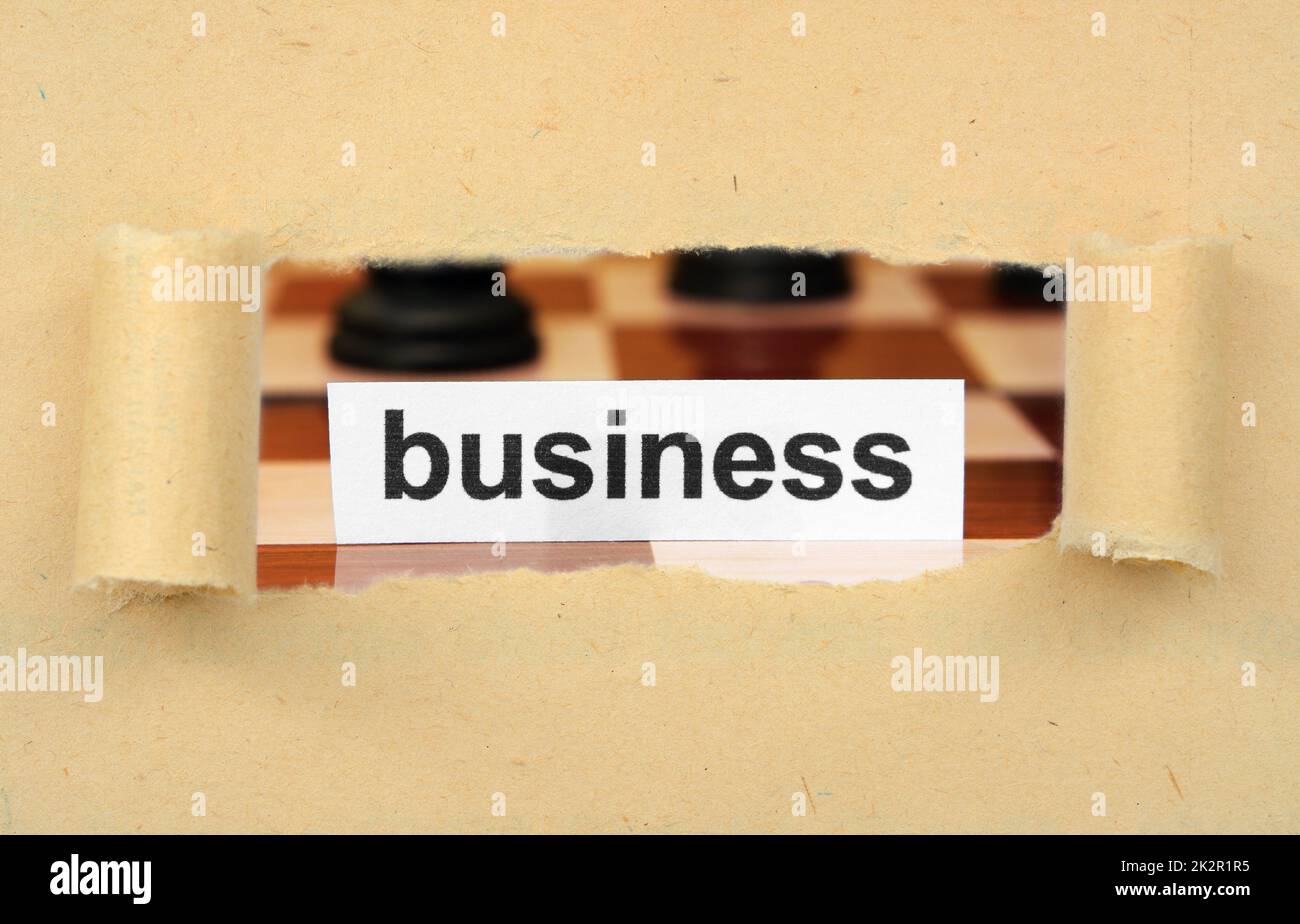 Business tag on ripped paper Stock Photo - Alamy