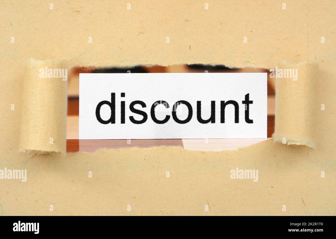 Discount tag on ripped paper Stock Photo - Alamy