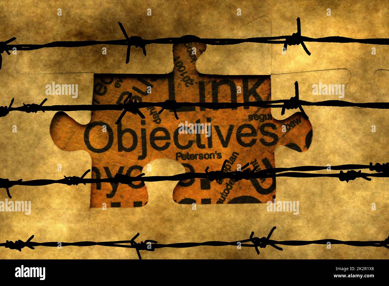 Objectives puzzle concept against barbwire Stock Photo - Alamy