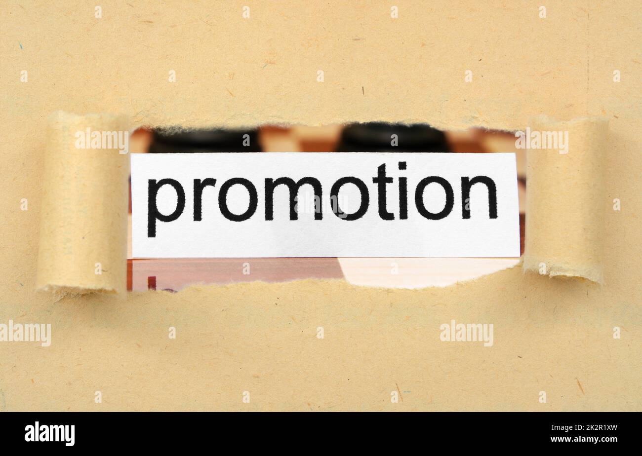 Promotion tag on ripped paper Stock Photo - Alamy