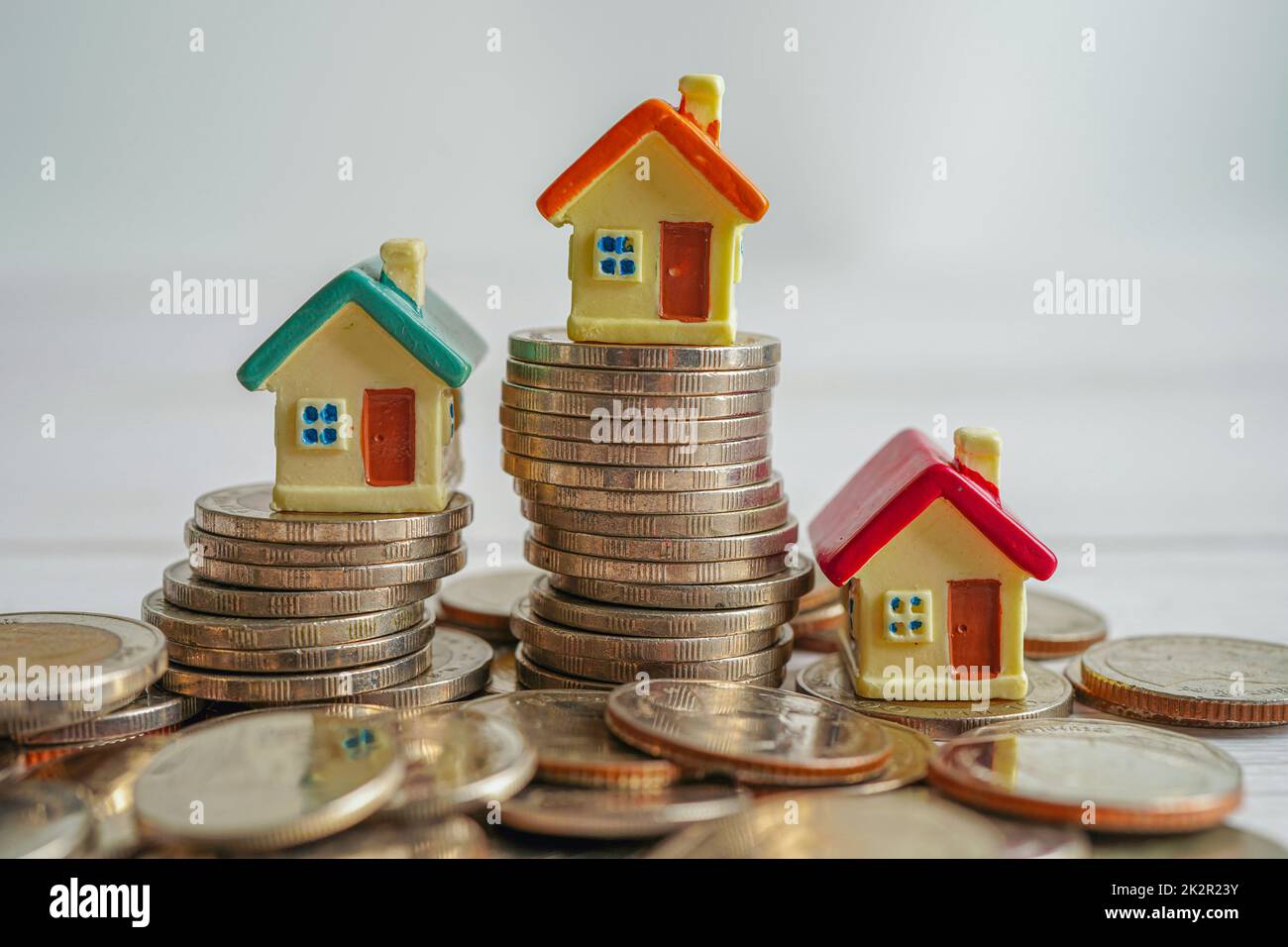 House on stack of coins, Investment property finance concept Stock ...