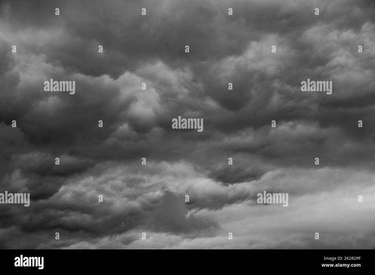 A grayscale of stormy clouds in the sky looking depressive Stock Photo ...