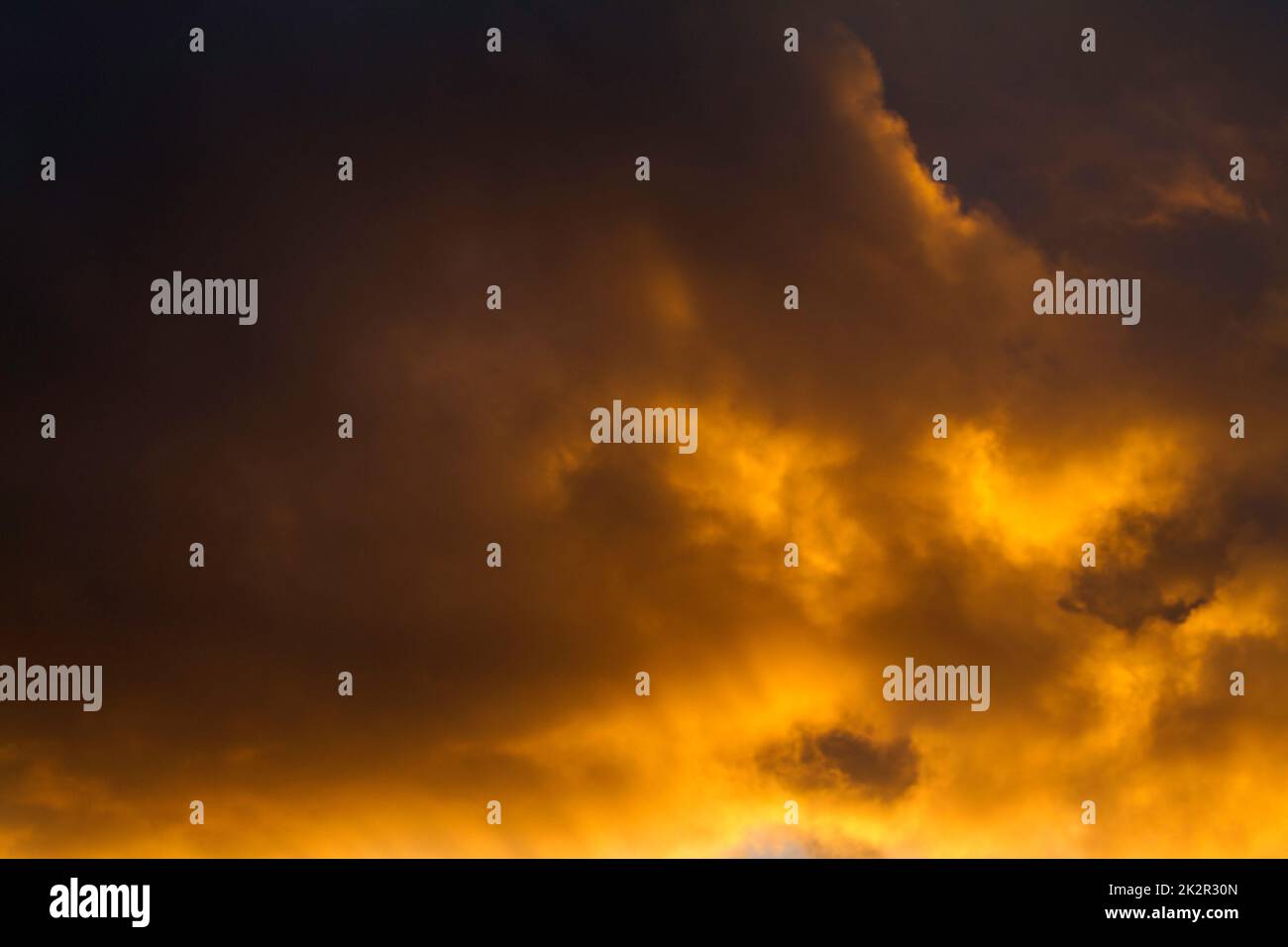 A breathtaking view of dark brown and orange sunset cloudscape Stock ...