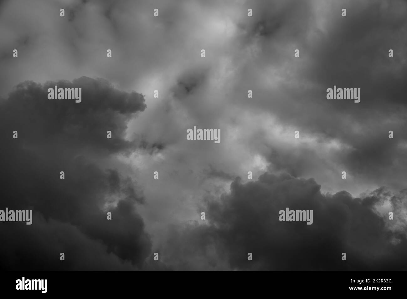 A grayscale of stormy clouds in the sky looking depressive Stock Photo ...