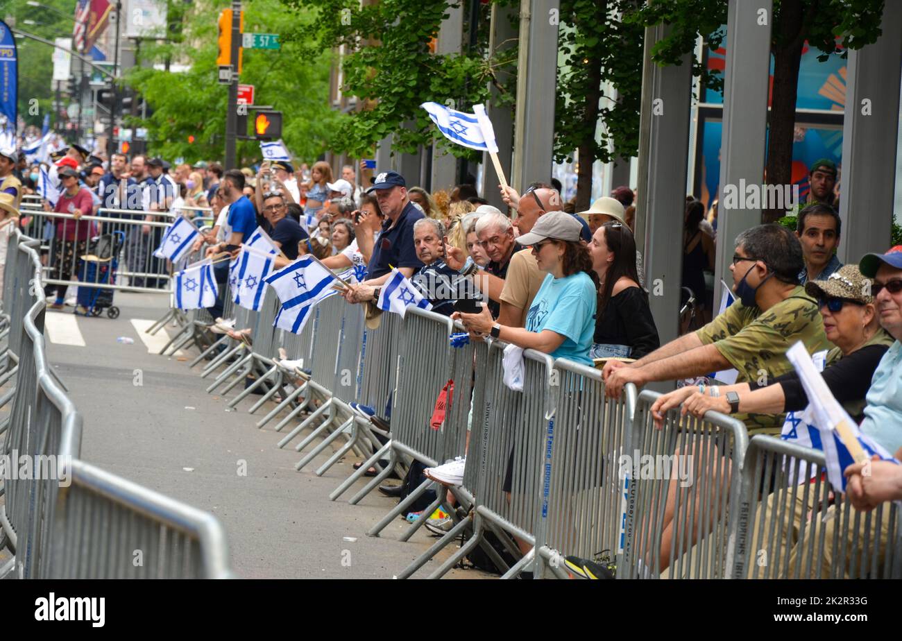 Several people with flags on the Annual Israel Day Parade along Fifth ...