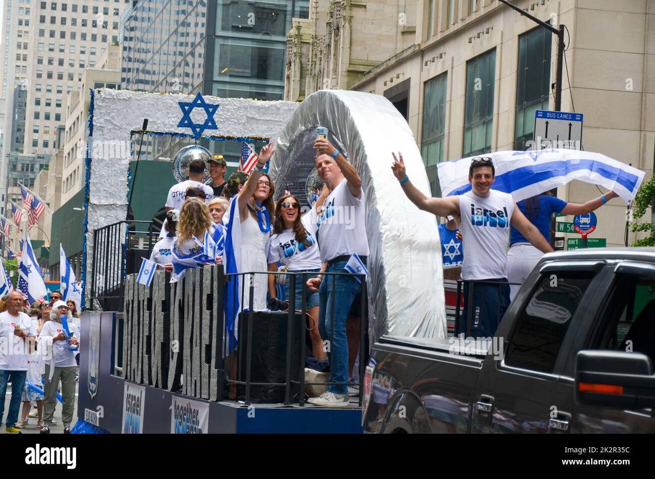 Several people with flags on the Annual Israel Day Parade along Fifth ...