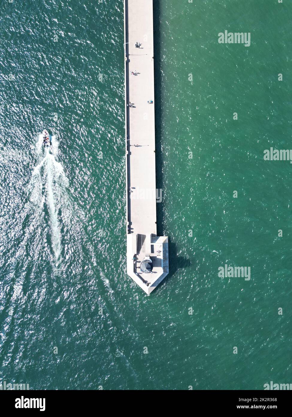 An aerial top view of the pier and a yacht sailing near Stock Photo - Alamy
