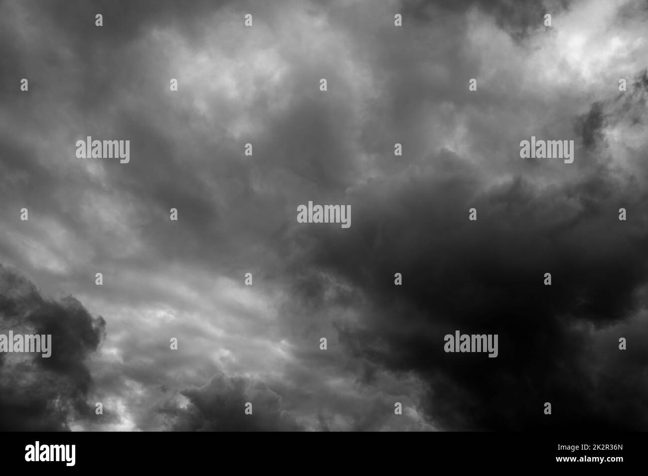 A grayscale of stormy clouds in the sky looking depressive Stock Photo ...