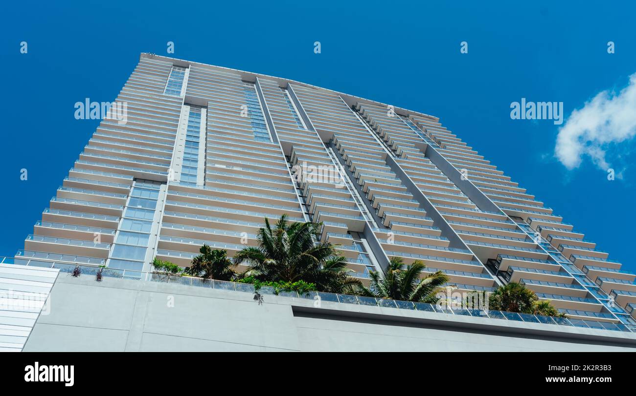 The low-angle view of a modern architecture building facade under the ...