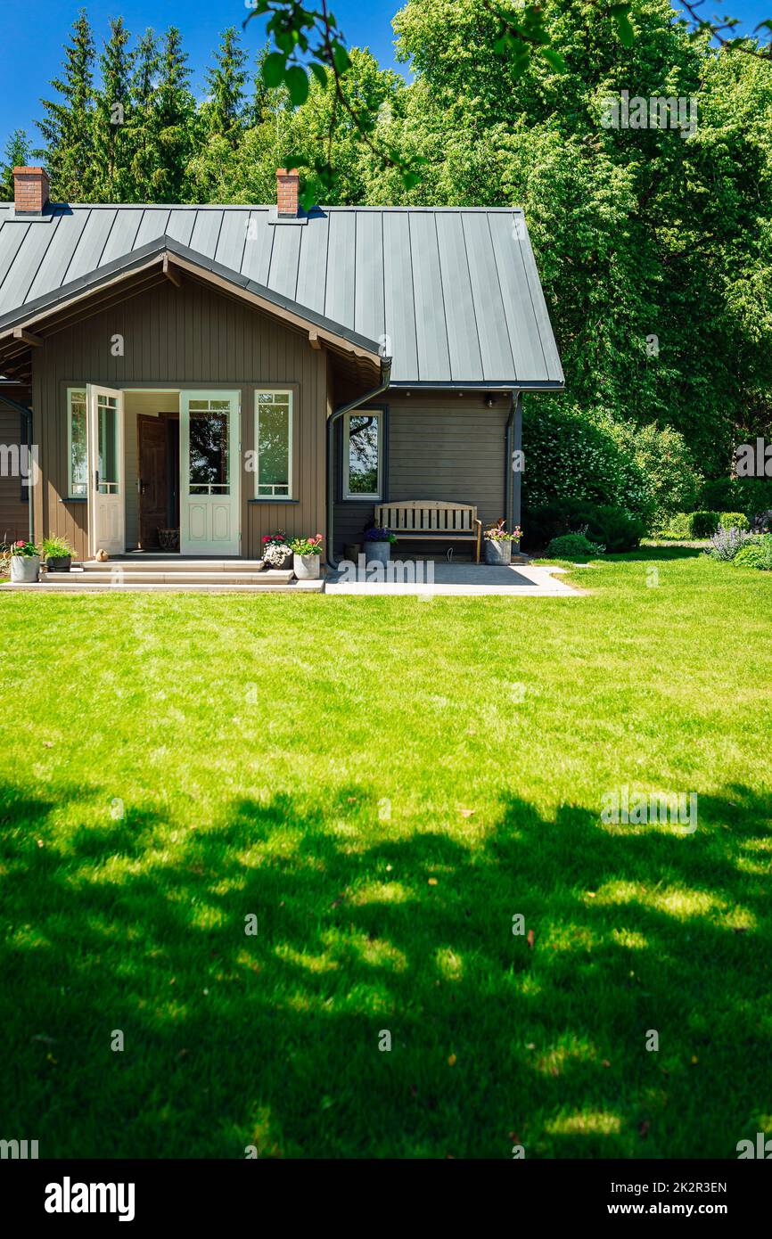A renovated wooden house in the countryside Stock Photo - Alamy