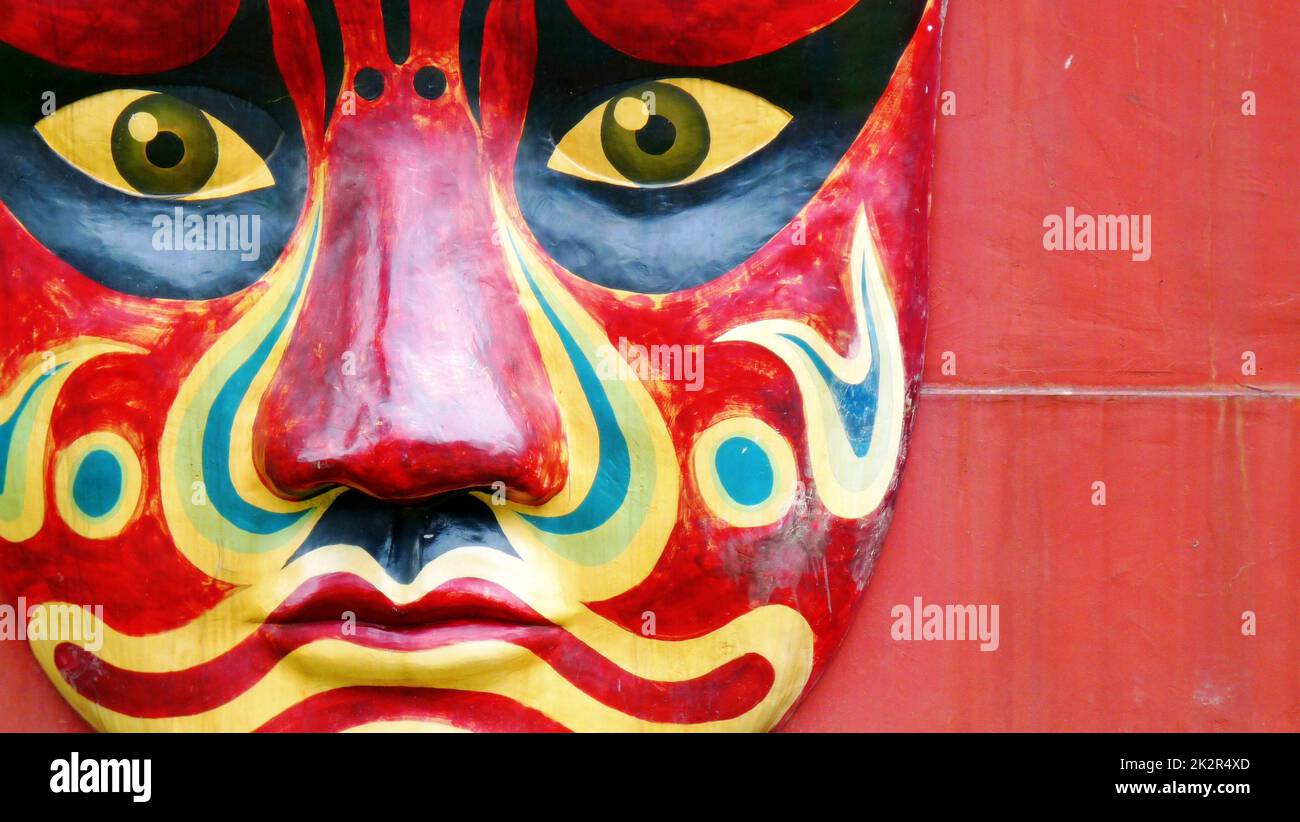 A close up of a bright folk mask Stock Photo - Alamy
