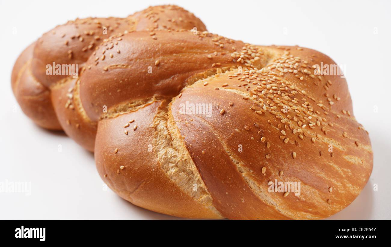 Uncovered challah bread for Shabbat on white background Stock Photo - Alamy