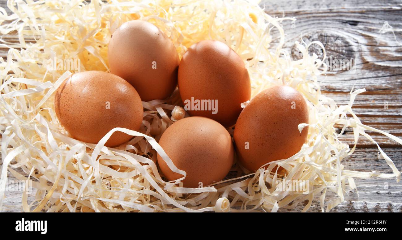 Composition with five chicken eggs on wood Stock Photo - Alamy