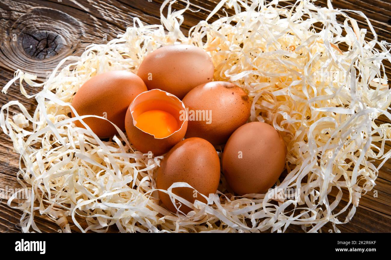 Composition with six chicken eggs on wood Stock Photo - Alamy