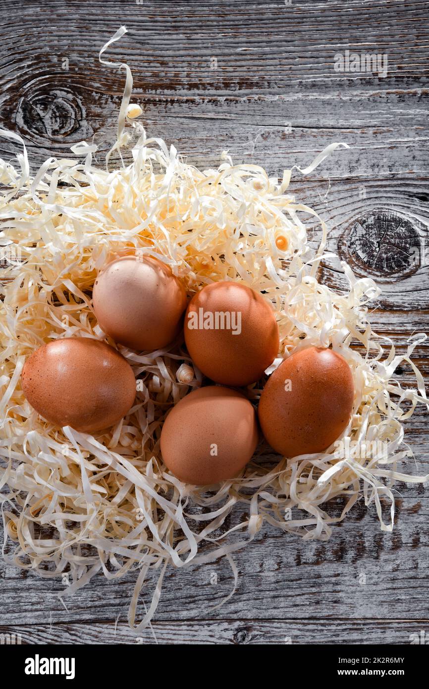 Composition with five chicken eggs on wood Stock Photo - Alamy