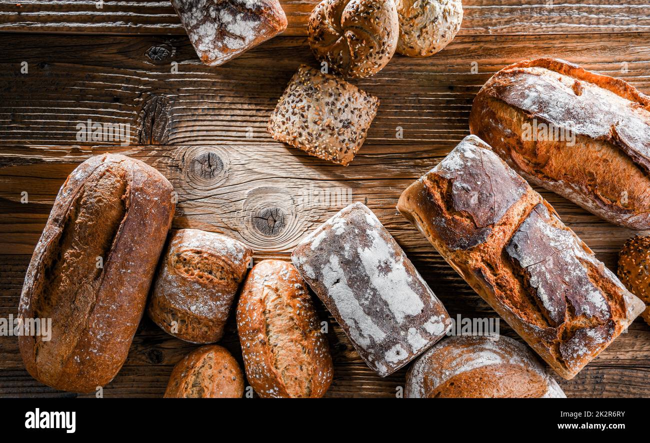 Composition with assorted bakery products on wooden table Stock Photo ...