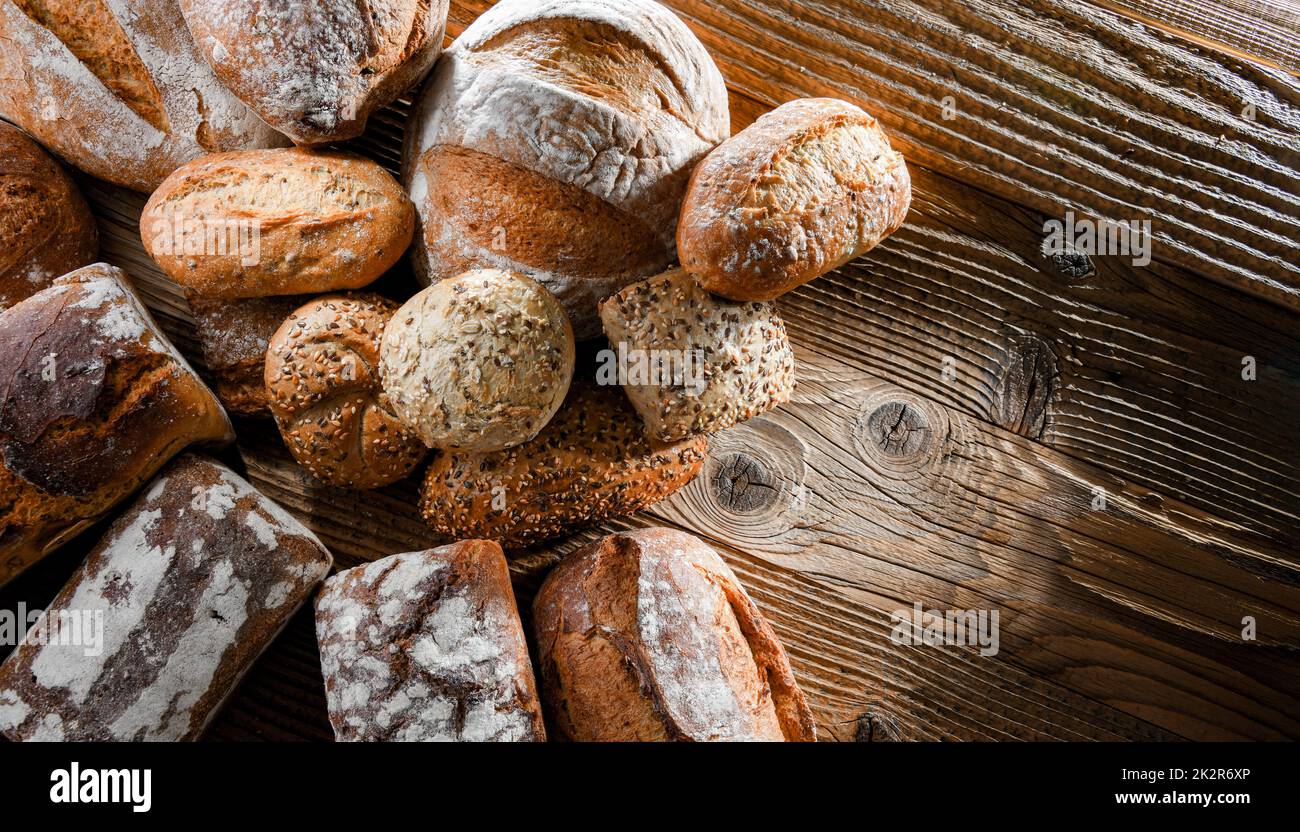 Composition with assorted bakery products on wooden table Stock Photo ...