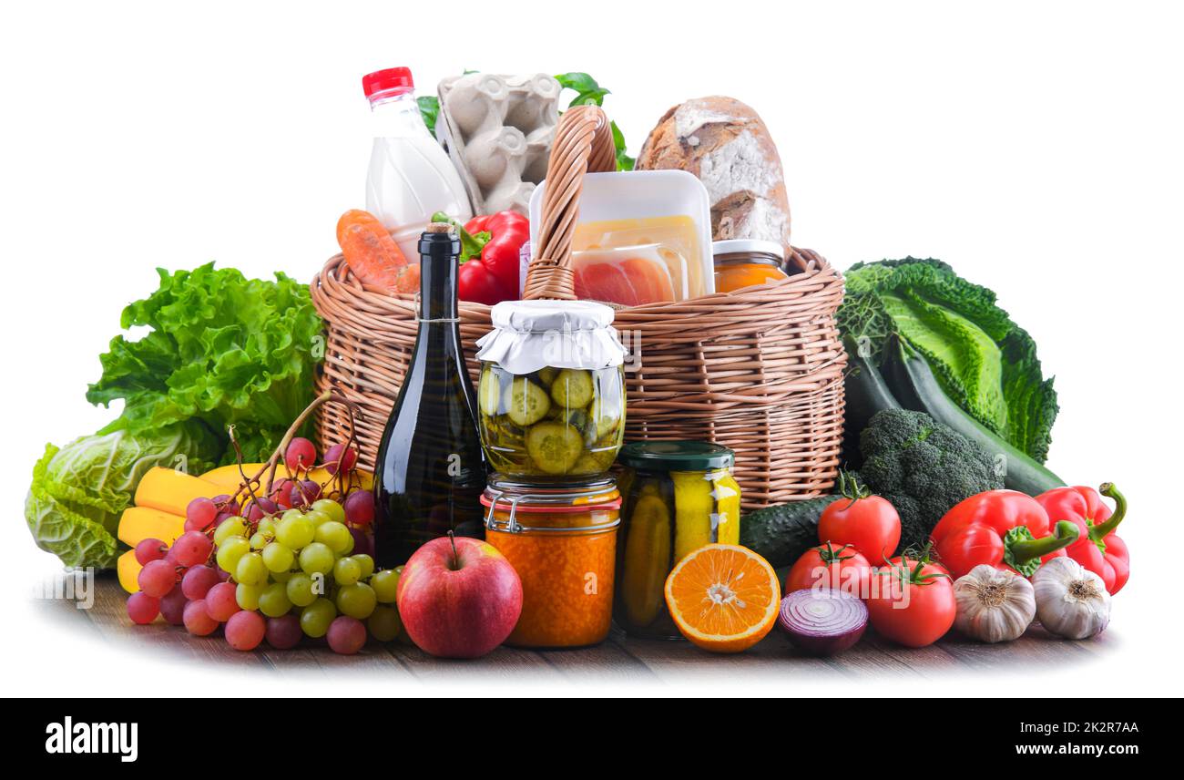 Wicker basket with assorted grocery products Stock Photo - Alamy