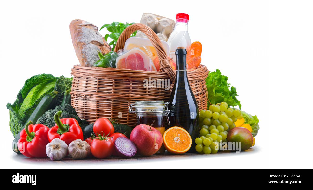 Wicker basket with assorted grocery products Stock Photo - Alamy