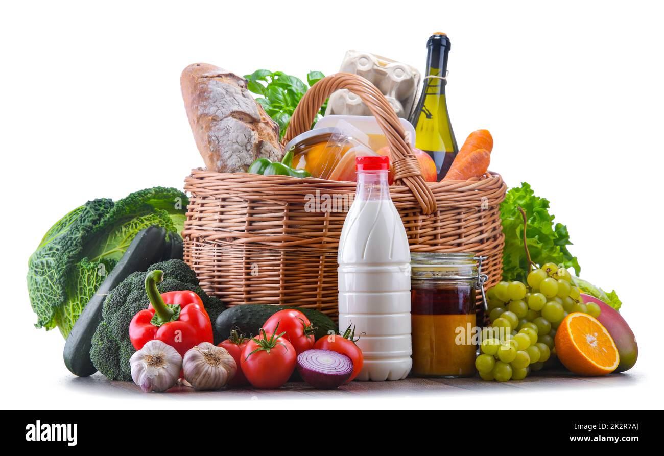 Wicker basket with assorted grocery products Stock Photo - Alamy