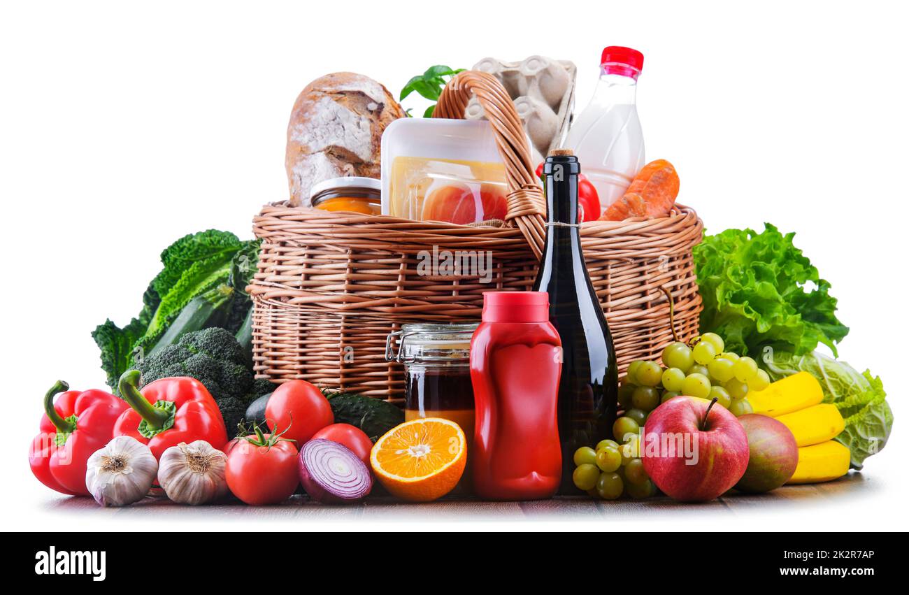 Wicker basket with assorted grocery products Stock Photo - Alamy