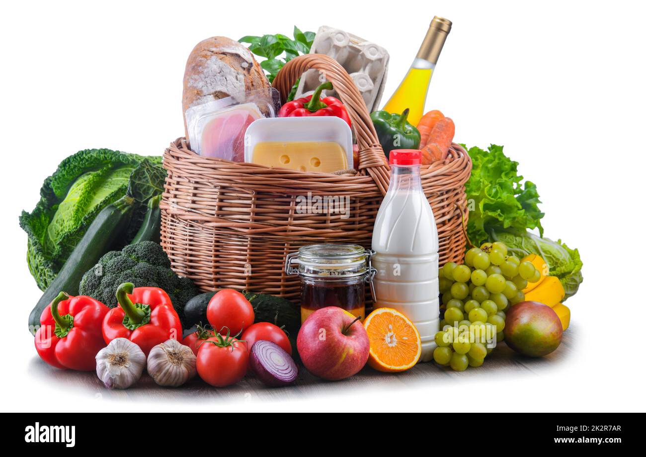 Wicker basket with assorted grocery products Stock Photo - Alamy