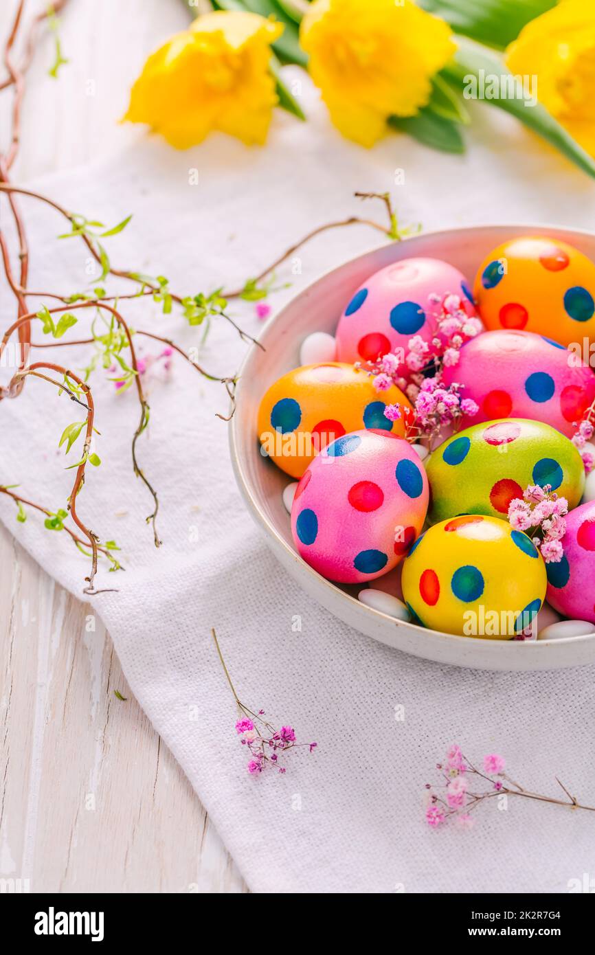 Easter eggs and tulips on grey background Stock Photo - Alamy