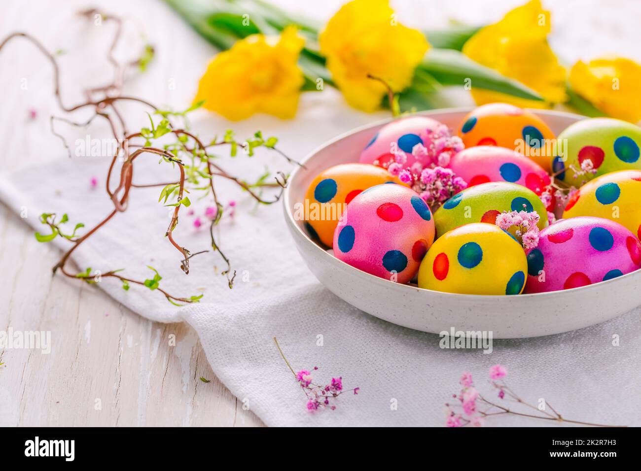 Easter eggs and tulips on grey background Stock Photo - Alamy