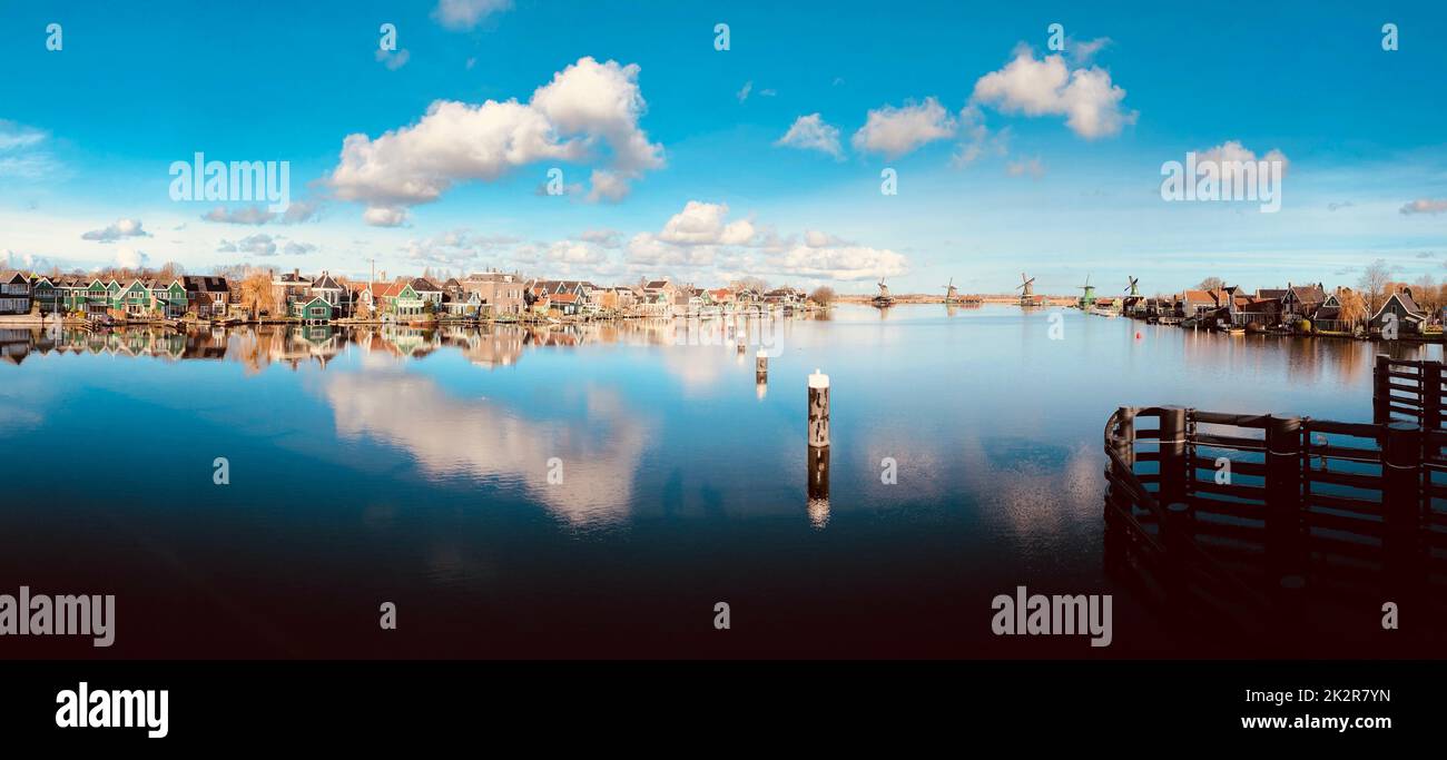 A wide-angle shot of a small coastal town next to a lake - great for ...
