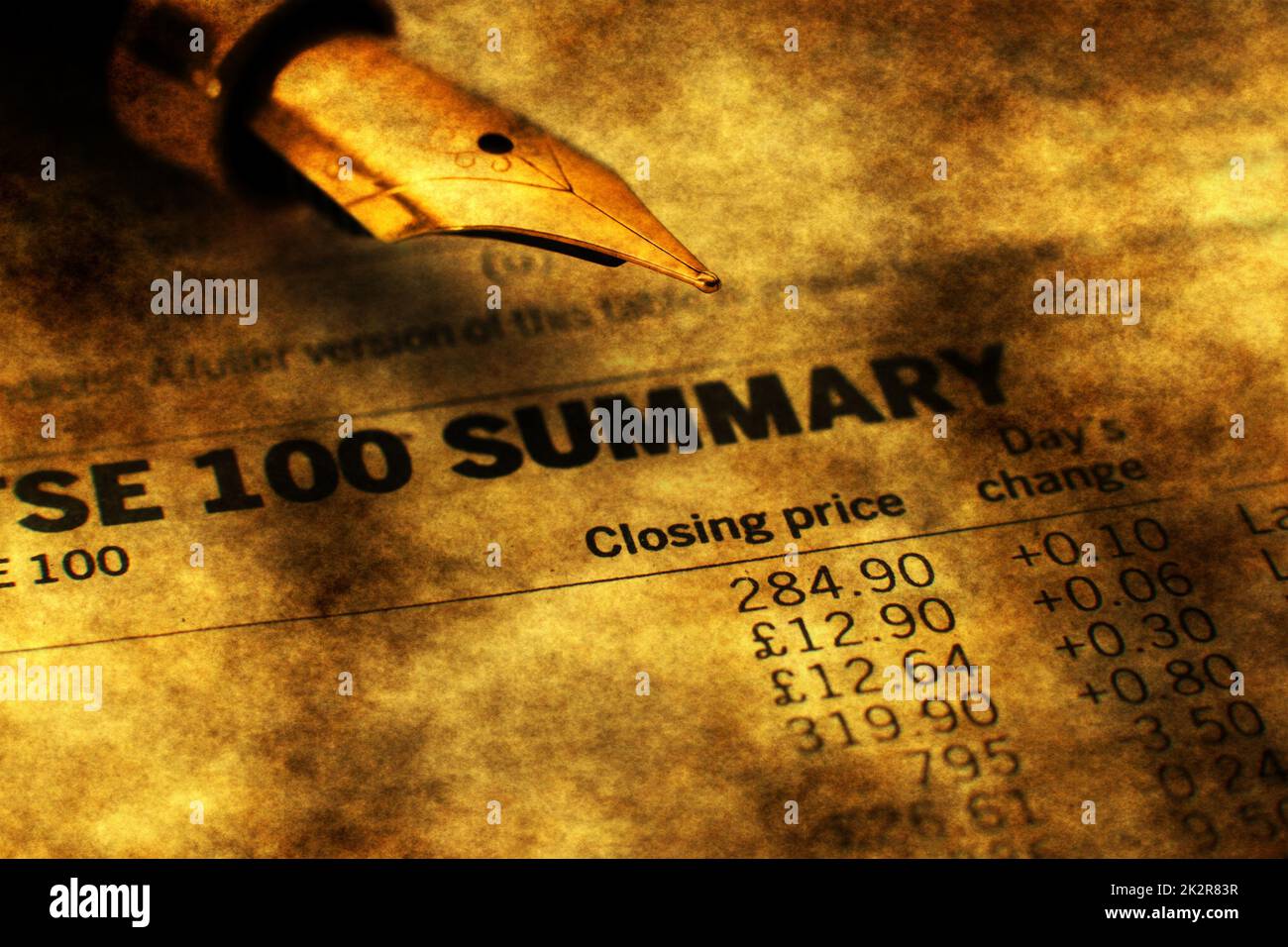 Fountain pen on stock market report Stock Photo - Alamy