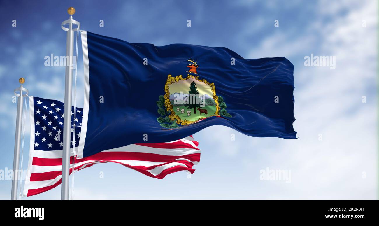 The Vermont state flag waving along with the national flag of the ...