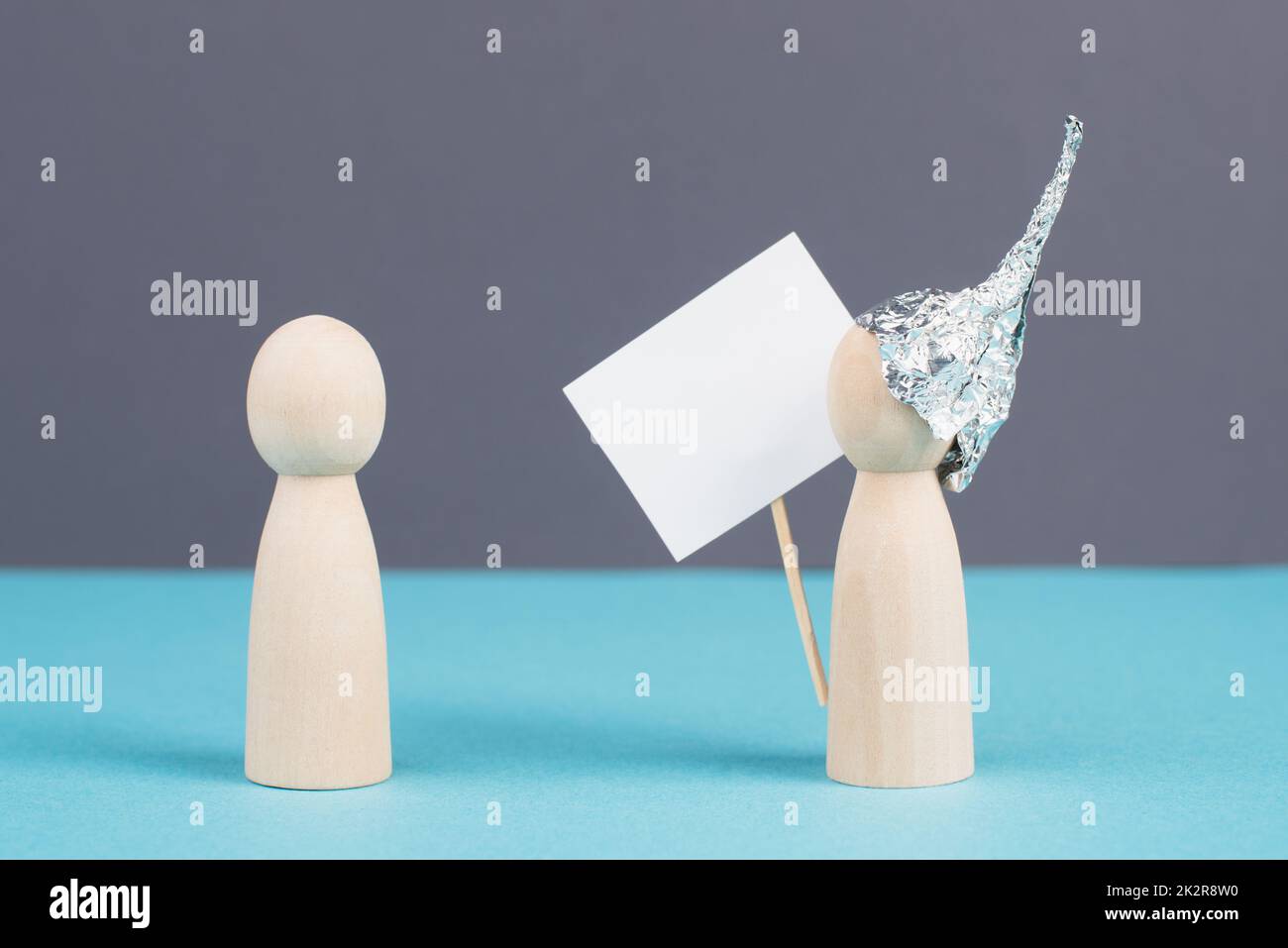 Group with alu hats protesters talking together, conspiracy theories ...